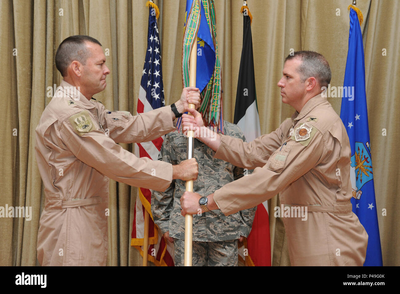 Col. Charles Bolton, 386th Air Expeditionary Wing commander, receives ...