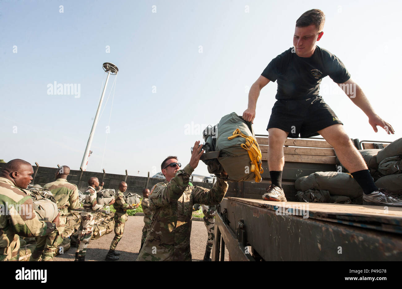 U.S. Army Staff Sgt. Brad Thomas (center), a paratrooper with the 82nd ...