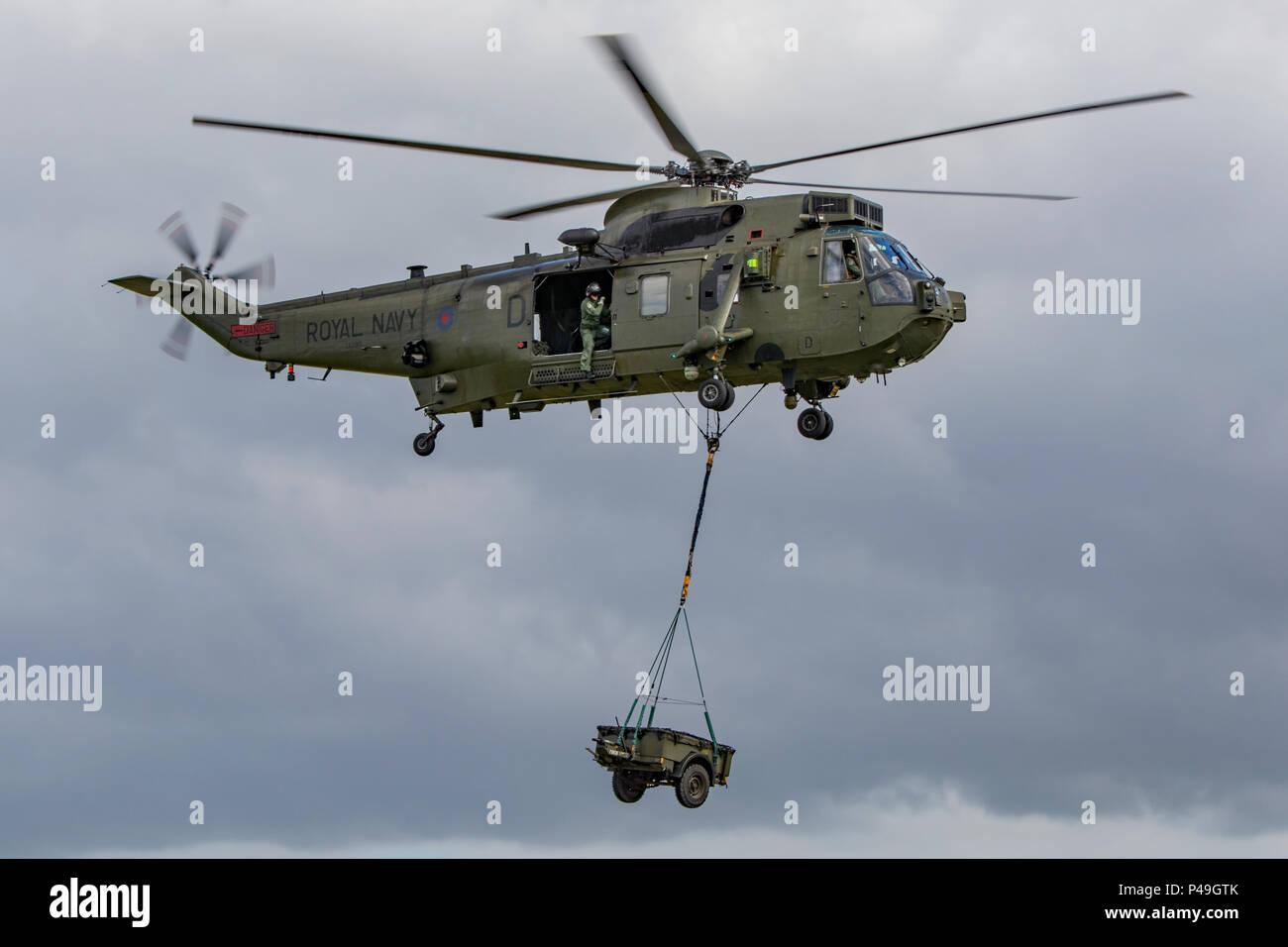 A British Royal Navy Sea King HC4 helicopter carrying out a load ...