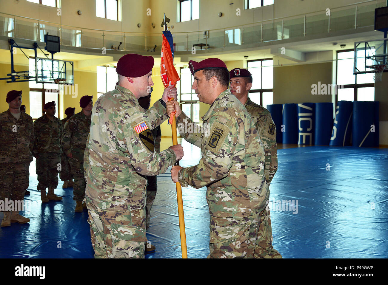 Capt. Kellan S. Sams, Company C commander, left, receives the guidon ...