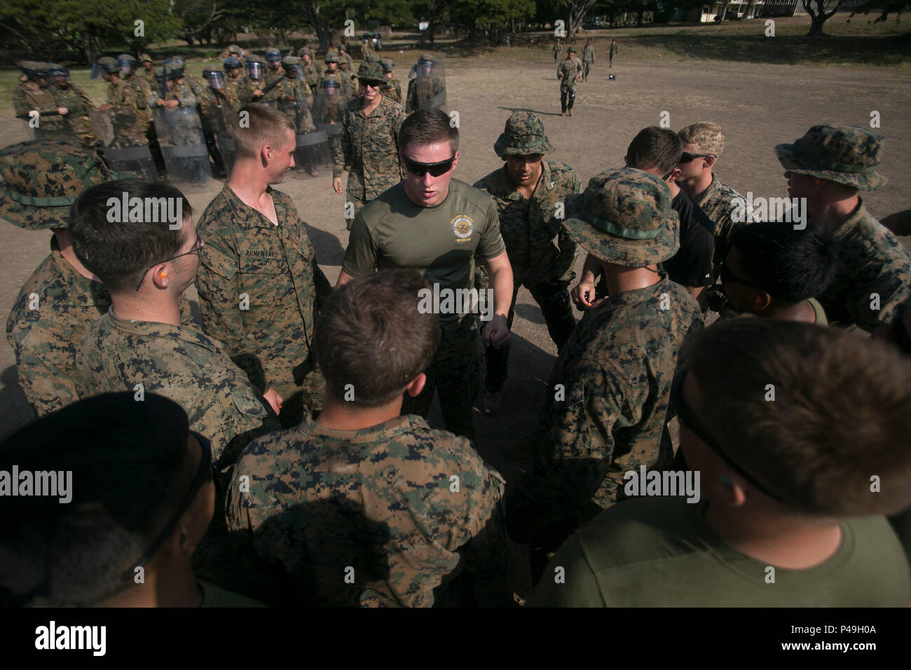 Cpl. Preston G. Thompson briefs a group of U.S. Marines acting as ...