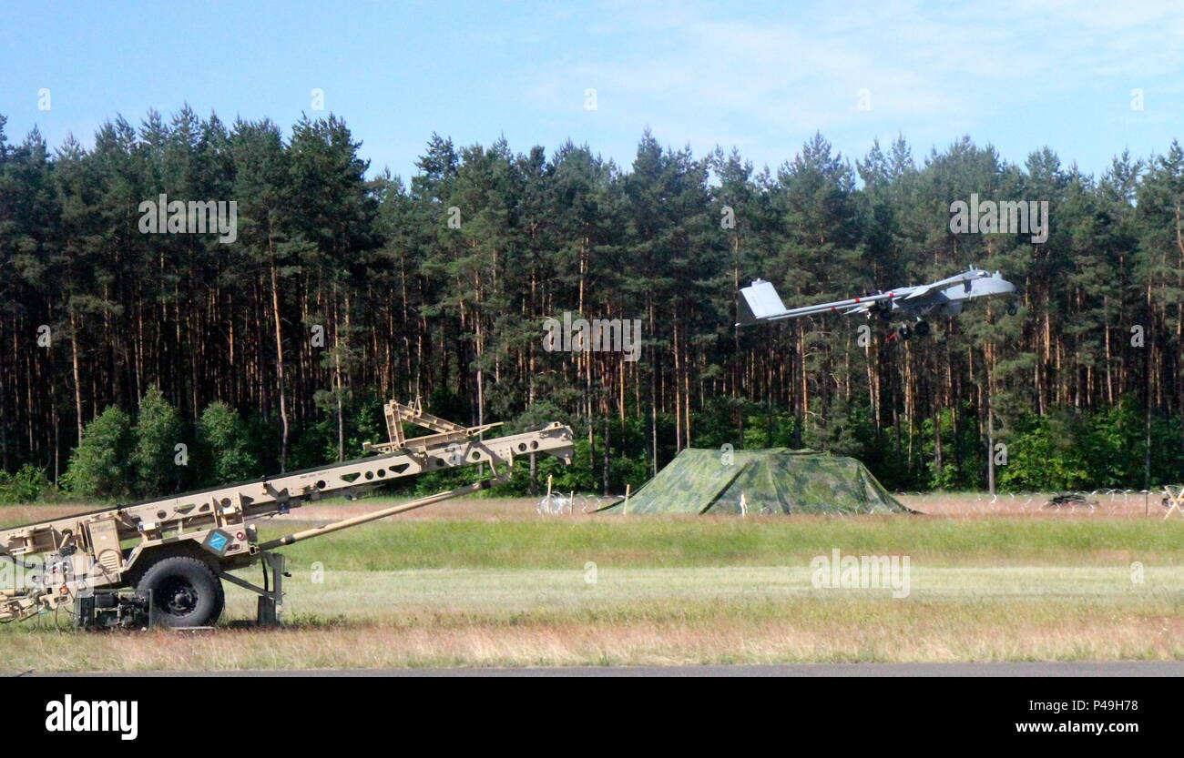 Soldiers from the 10th Engineer Battalion prepare and launch an RQ-7B ...