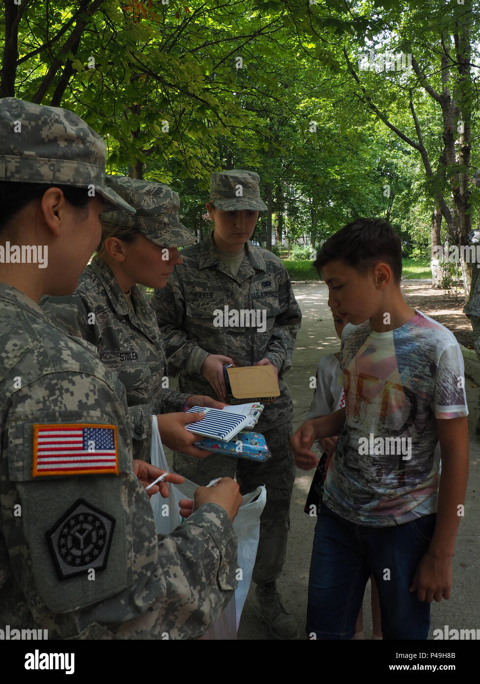(From left to right) U.S. Army Maj. Kris Chow, assigned to the 457th ...