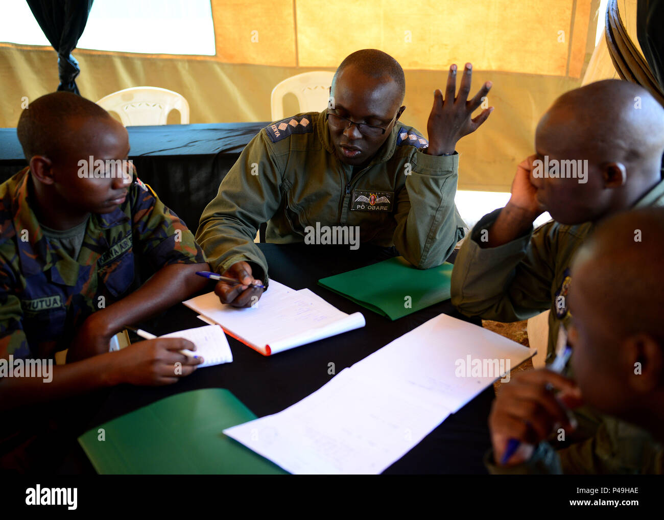 Kenyan Defense Force airmen discuss classroom lectures during African ...