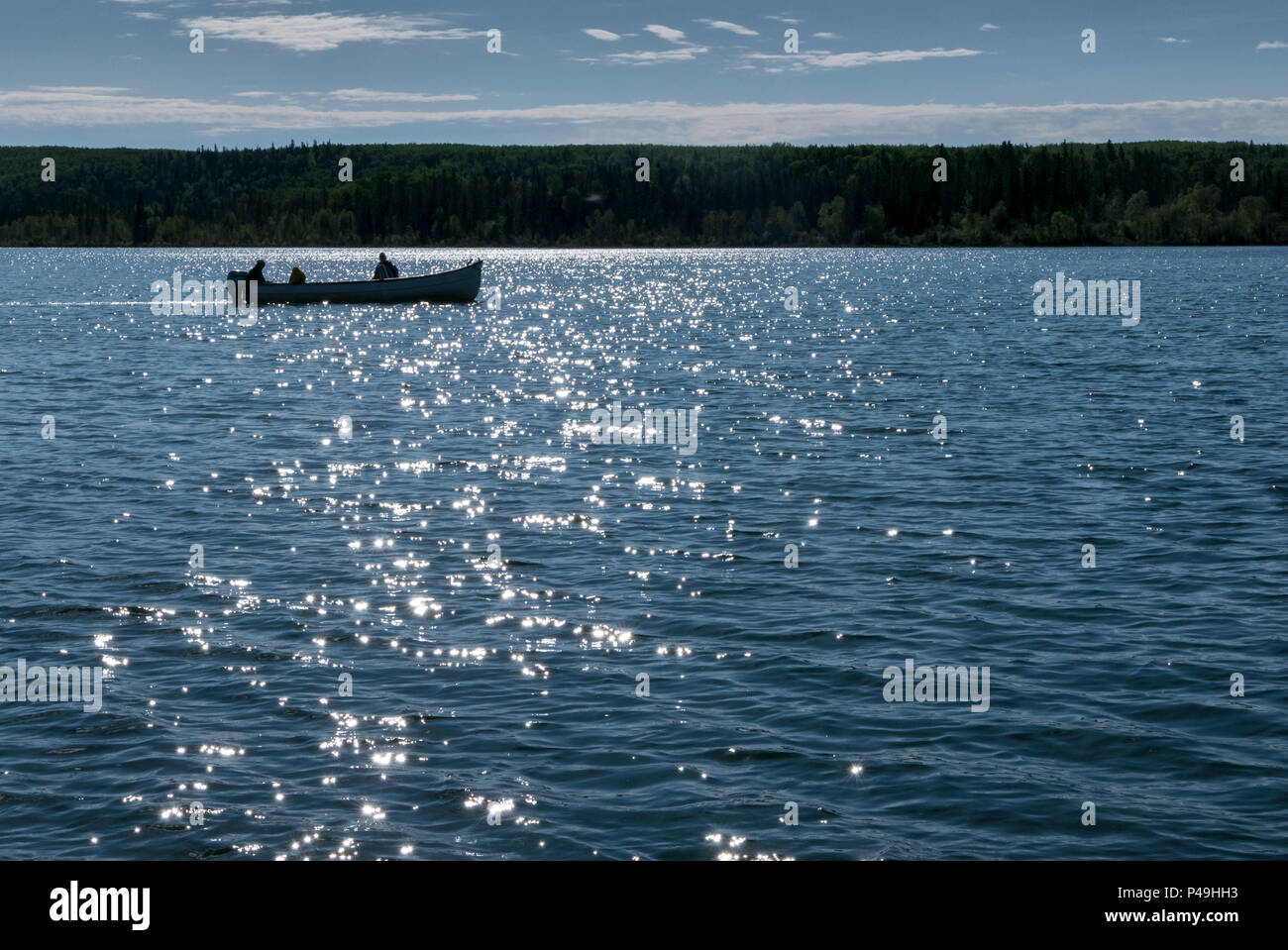 Fishing from boat on sparkling lake, Dore Lake, Saskatchewan, Canada ...