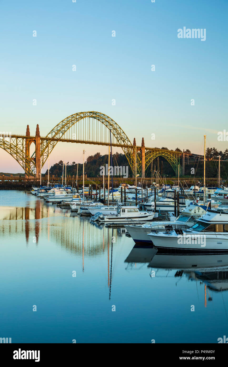 Boats moored in Port of Newport Marina and Yaquina Bay Bridge, Newport ...