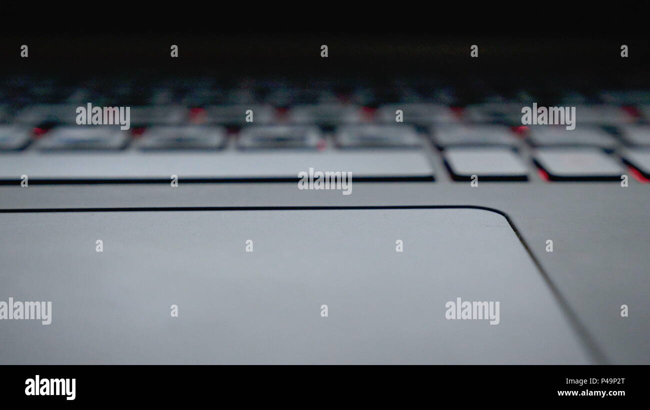 Close-up view fingers tapping keypad of laptop scrolling and stretching ...