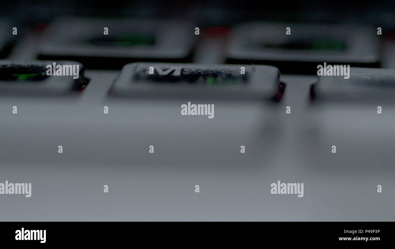 Close-up view fingers tapping keypad of laptop and writing message ...