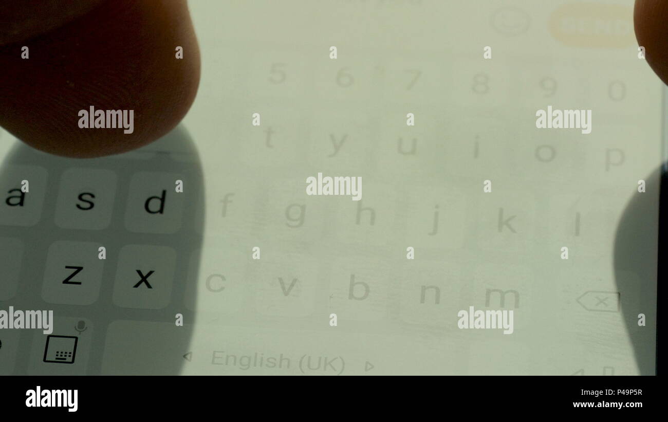 Fingers tapping on smartphone screen hi-res stock photography and ...