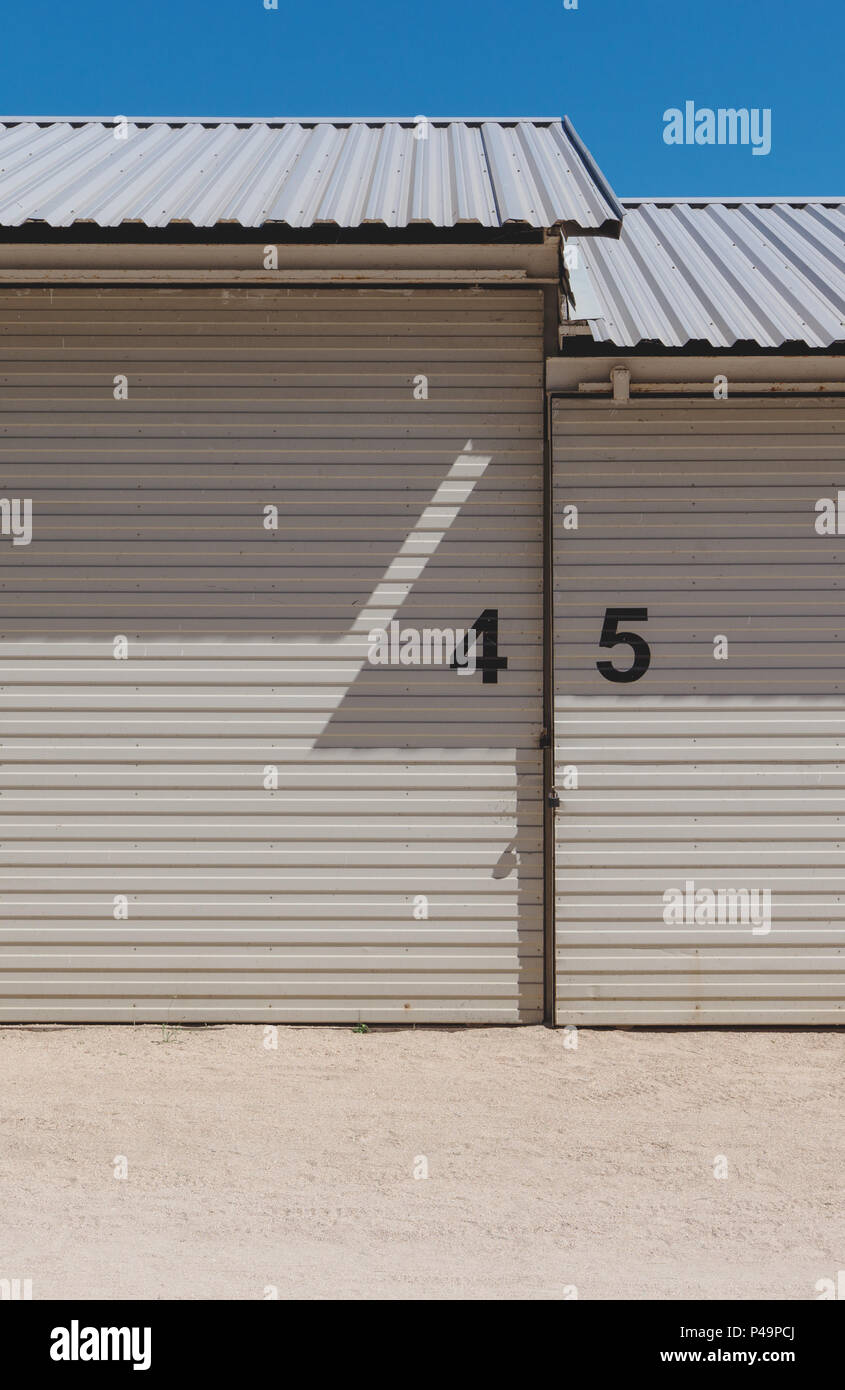 Industrial warehouse building with numbers on the wall. Abstract ...