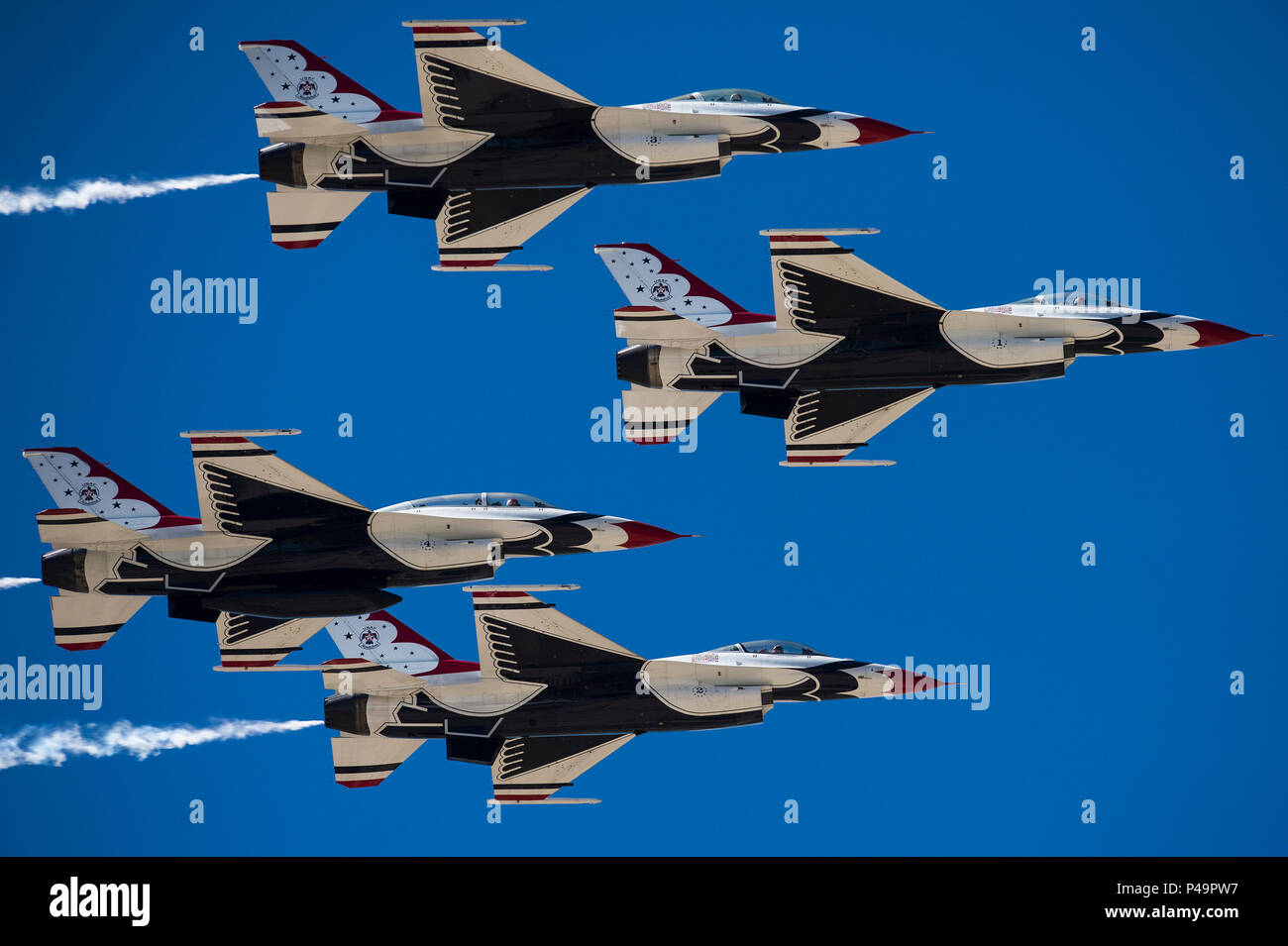 The Thunderbirds pilots perform the Diamond Clover-Loop Opener maneuver ...