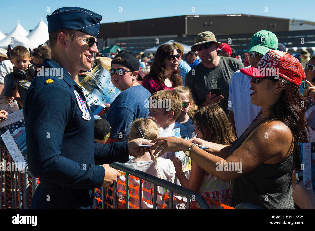 Maj. Christopher Scheibler, Thunderbird #9, signs autographs after the ...