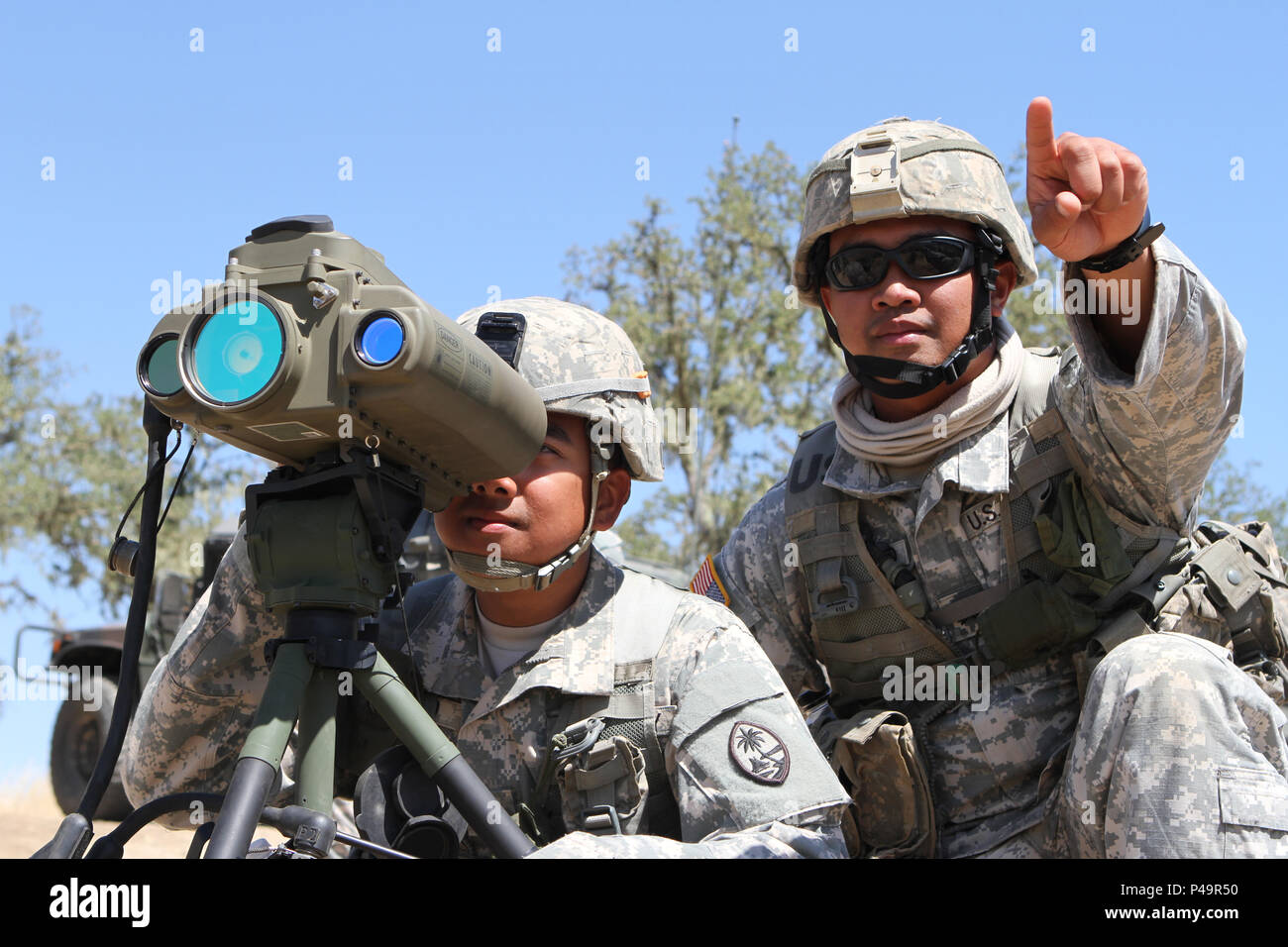 Fire support specialists Pfc. Ian P. Elago, left, and forward observer ...