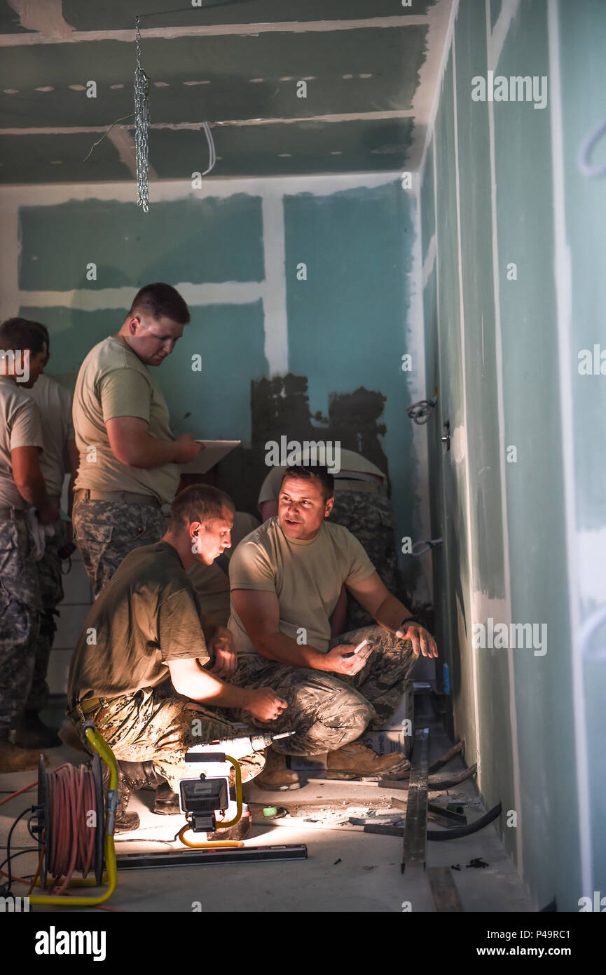 Tech Sgt Scott Leffler of the 133rd Civil Engineer Squadron works ...