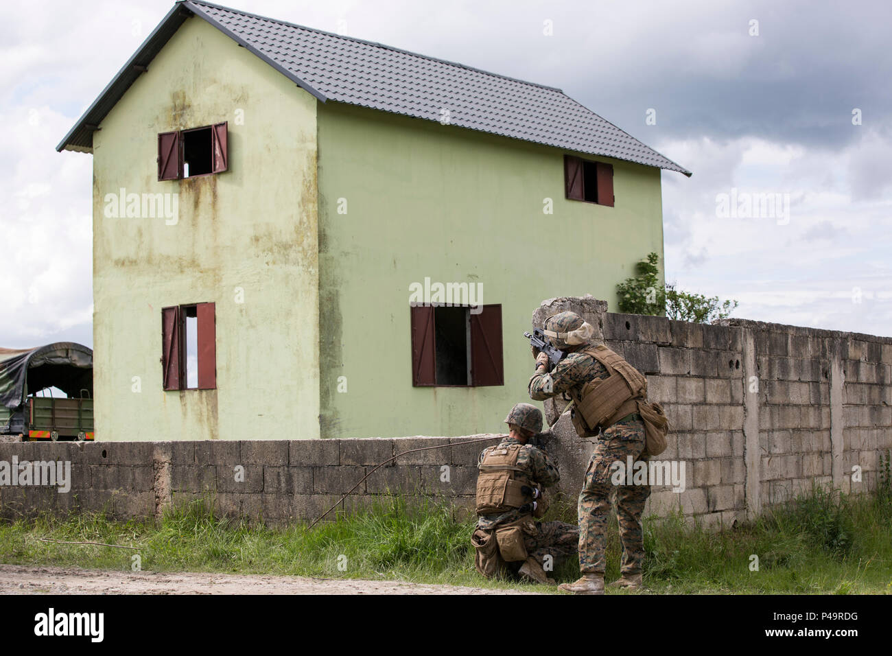 U.S. Marine Corps Lance Cpl. Ryan L. Carden, (left), a rifleman and ...