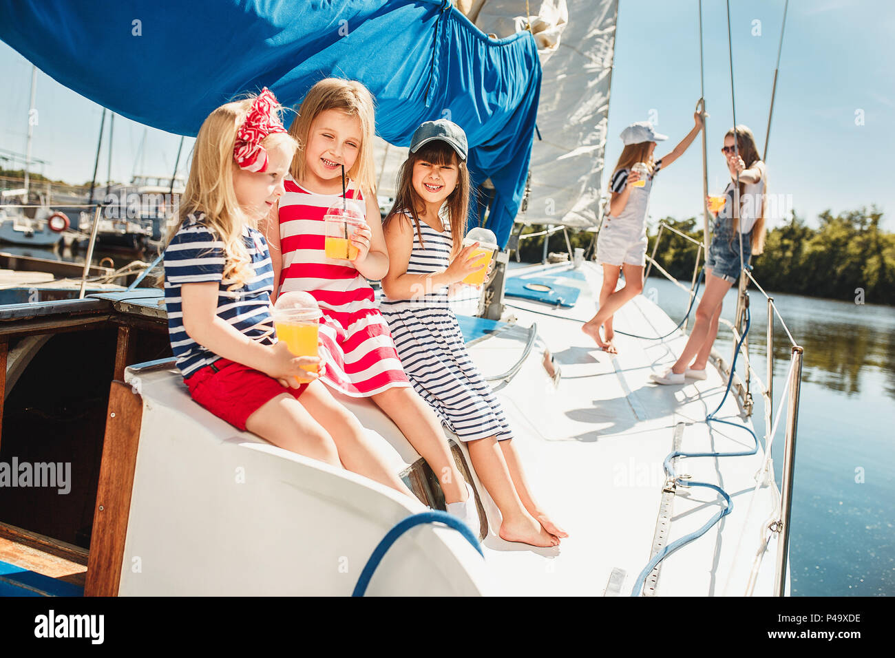 The children on board of sea yacht Stock Photo - Alamy