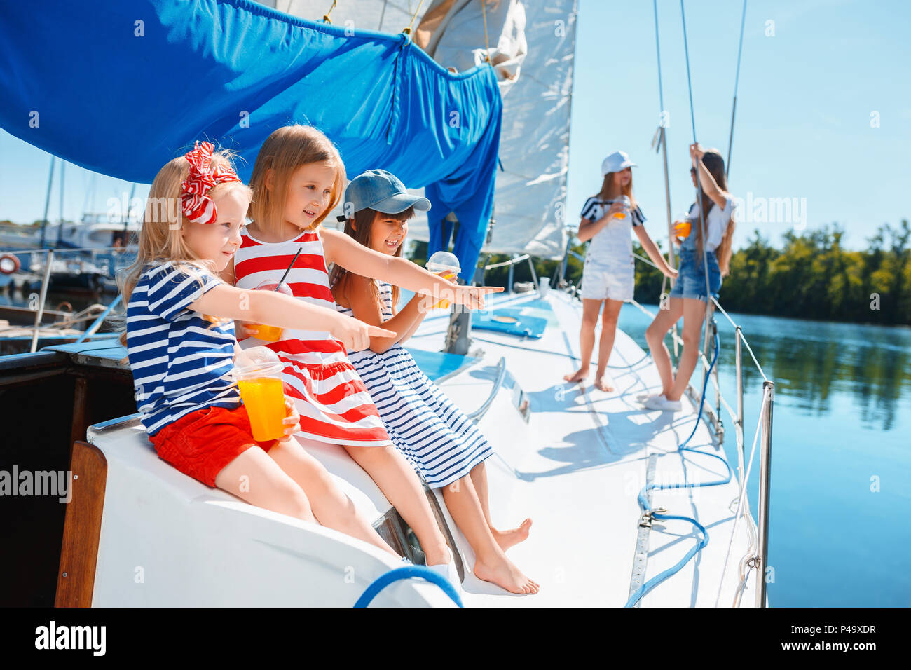 The children on board of sea yacht Stock Photo - Alamy
