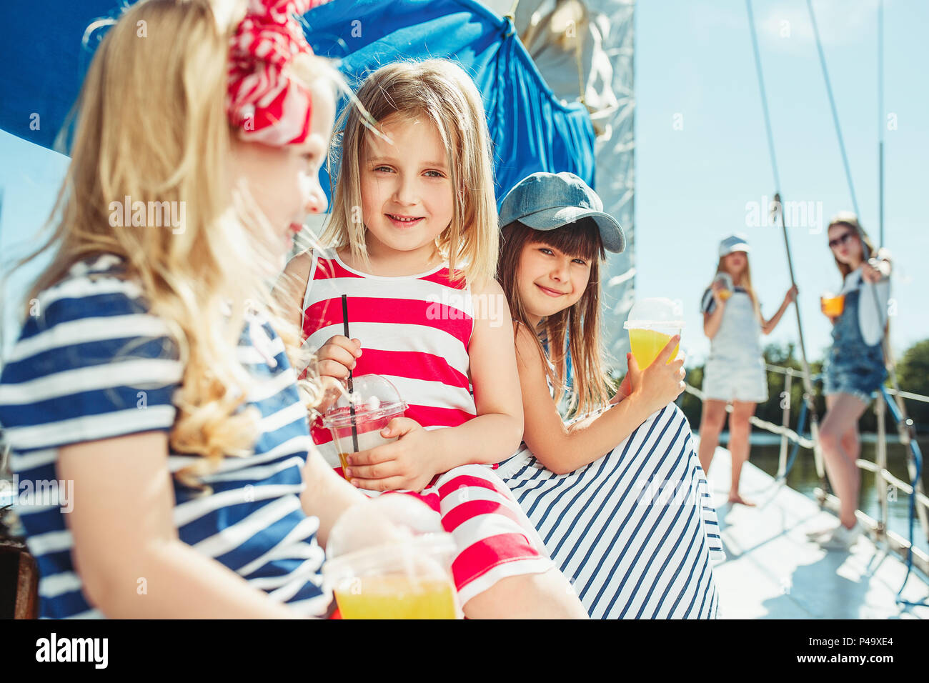 The children on board of sea yacht Stock Photo - Alamy
