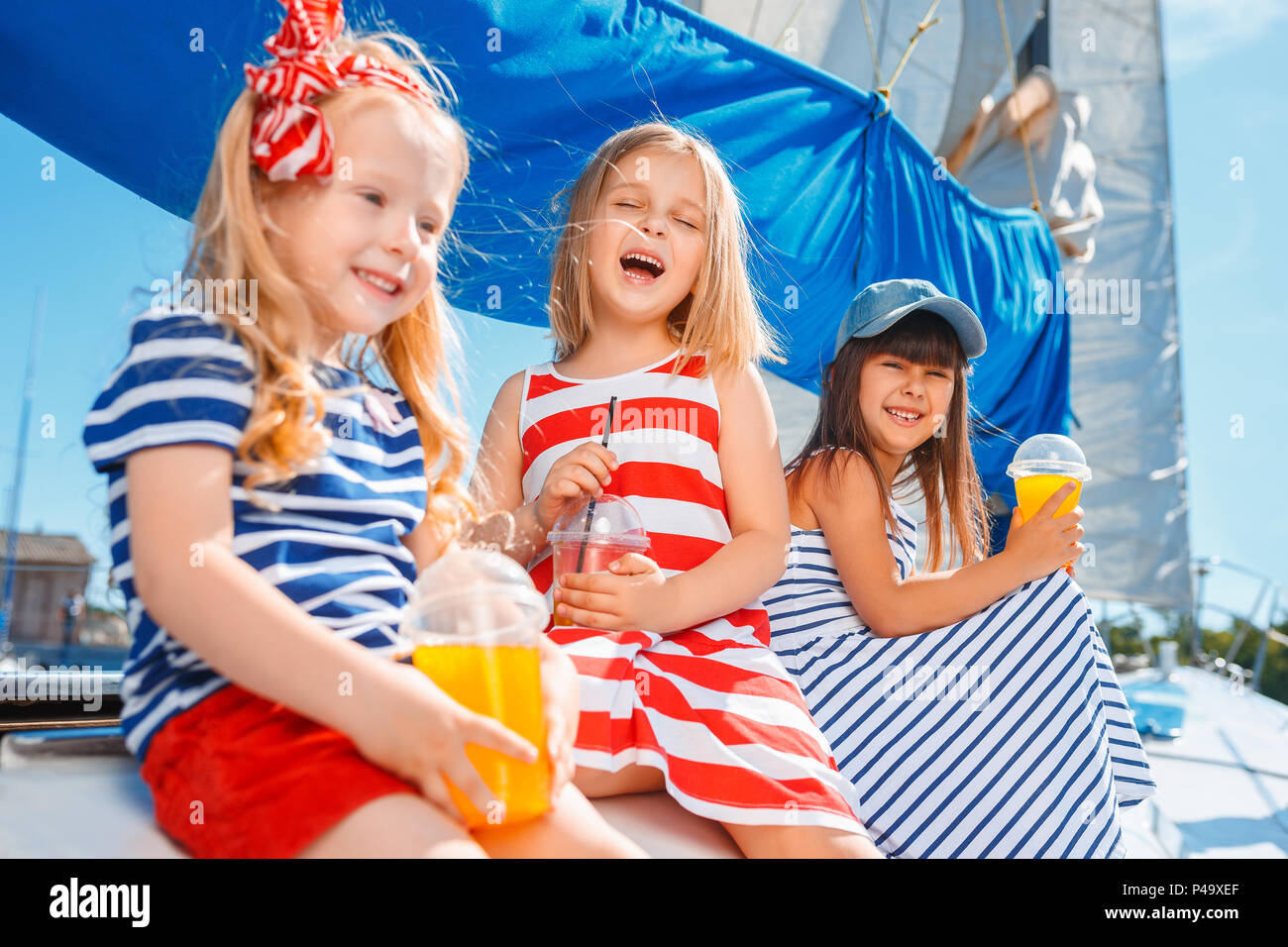 The children on board of sea yacht Stock Photo - Alamy