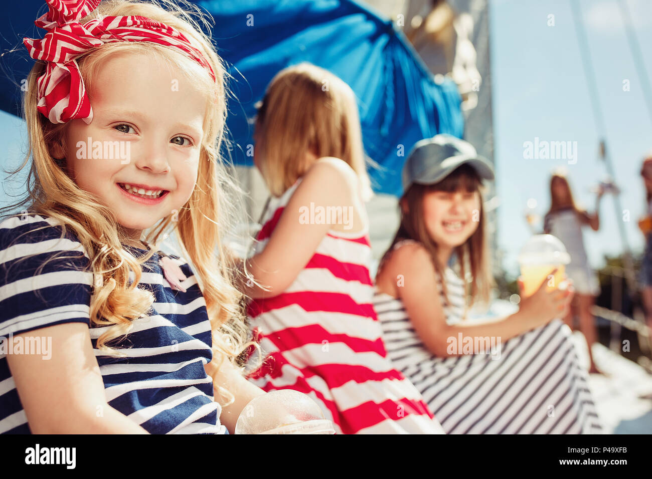The children on board of sea yacht Stock Photo - Alamy