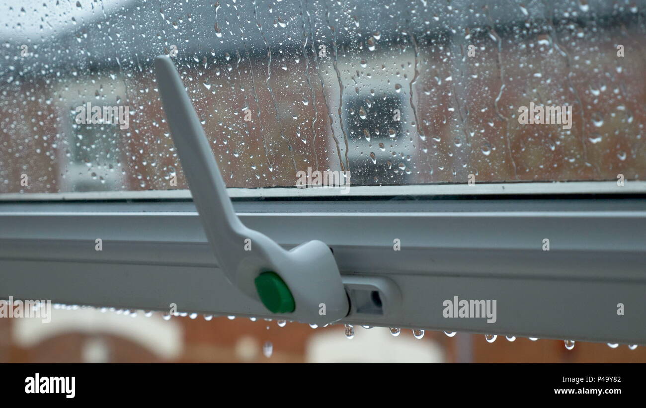 Large rain drops strike open window pane during heavy shower in England Stock Photo - Alamy