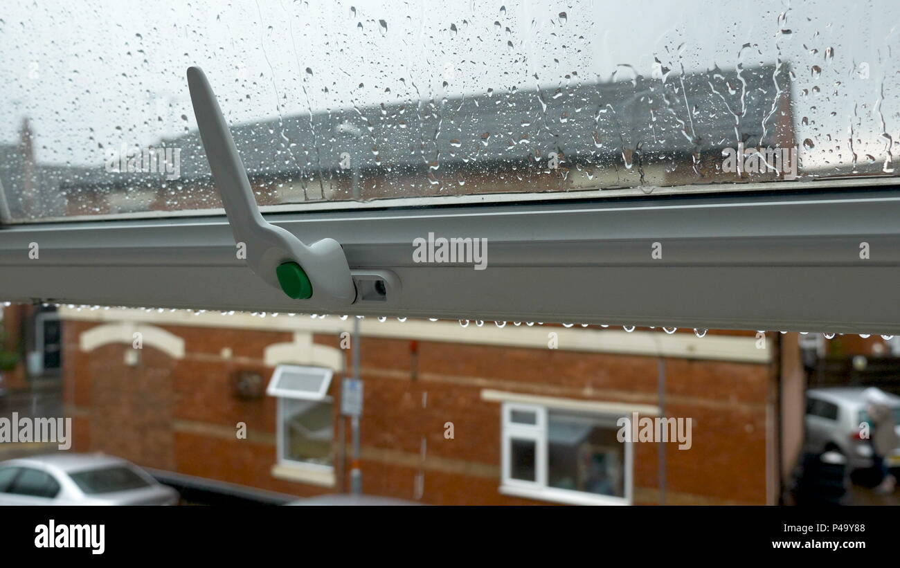 Large rain drops strike open window pane during heavy shower in England Stock Photo - Alamy
