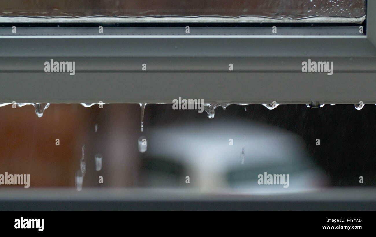 Large rain drops strike open window pane during heavy shower in England Stock Photo - Alamy