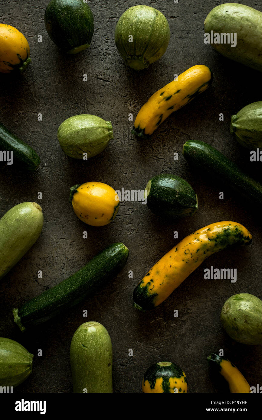 Yellow and Green Round Zucchini on Rustic Dark Background Stock Photo ...