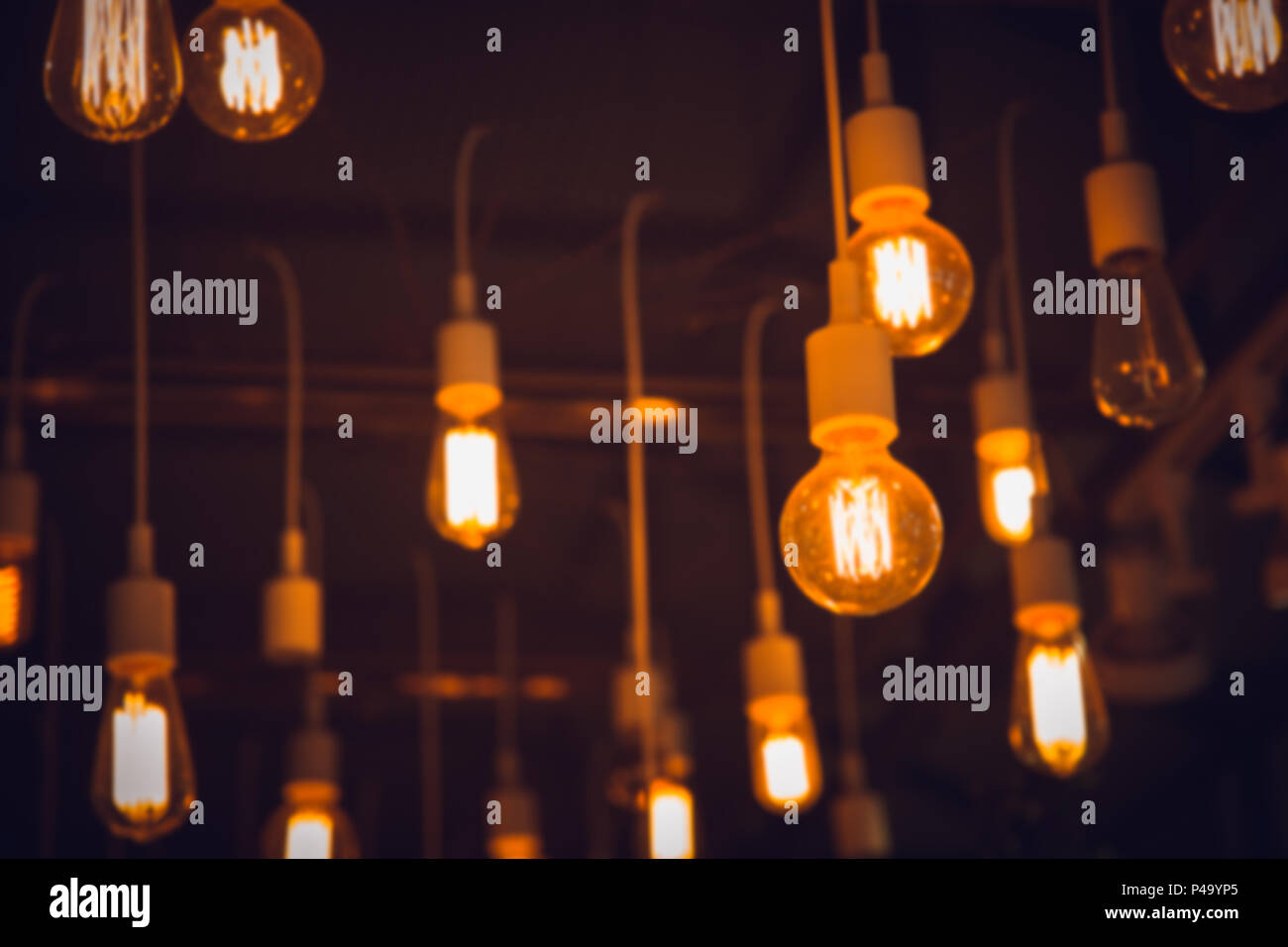 blur hang light blub interior cafe lighting for background Stock Photo ...