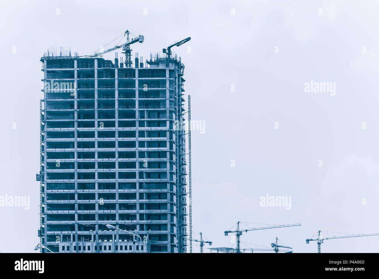 Hoisting cranes under construction crane working building construction ...