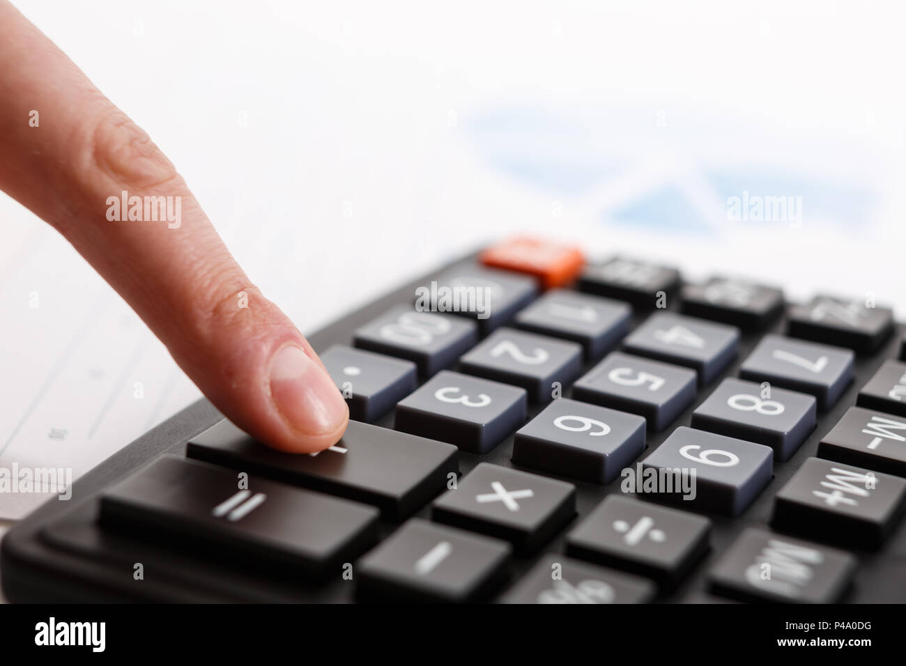 Business people who use a calculator with financial concepts Stock ...