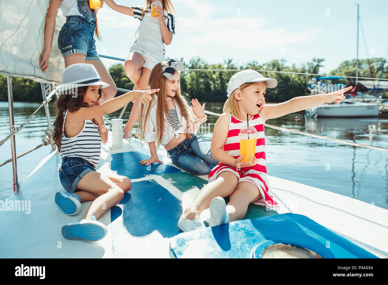The children on board of sea yacht Stock Photo - Alamy