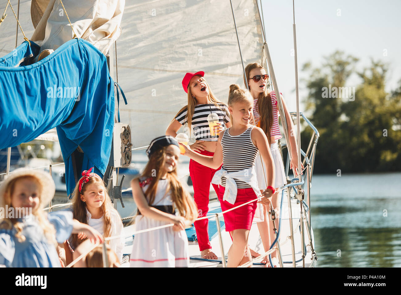 The children on board of sea yacht Stock Photo - Alamy