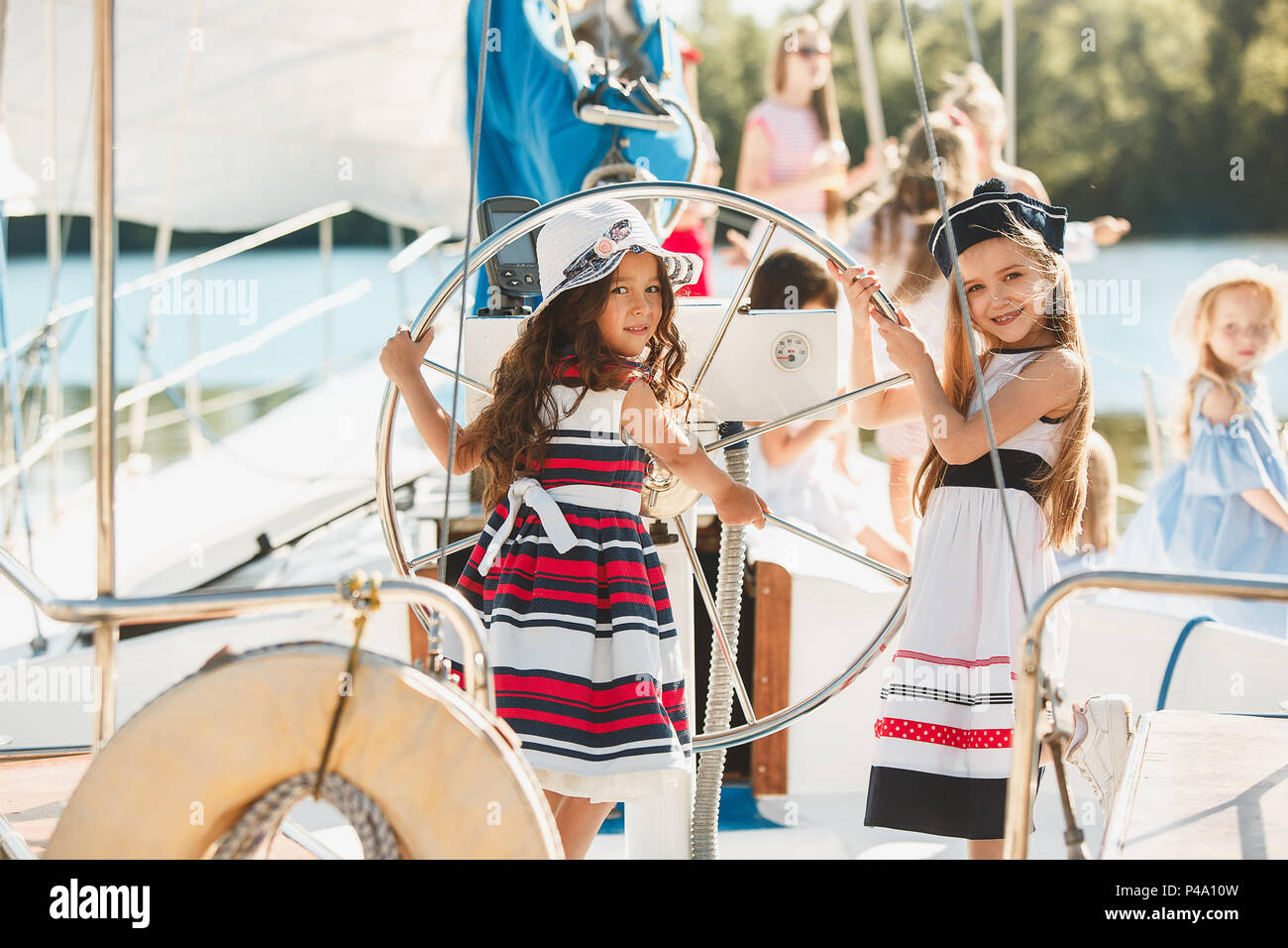 The children on board of sea yacht Stock Photo - Alamy