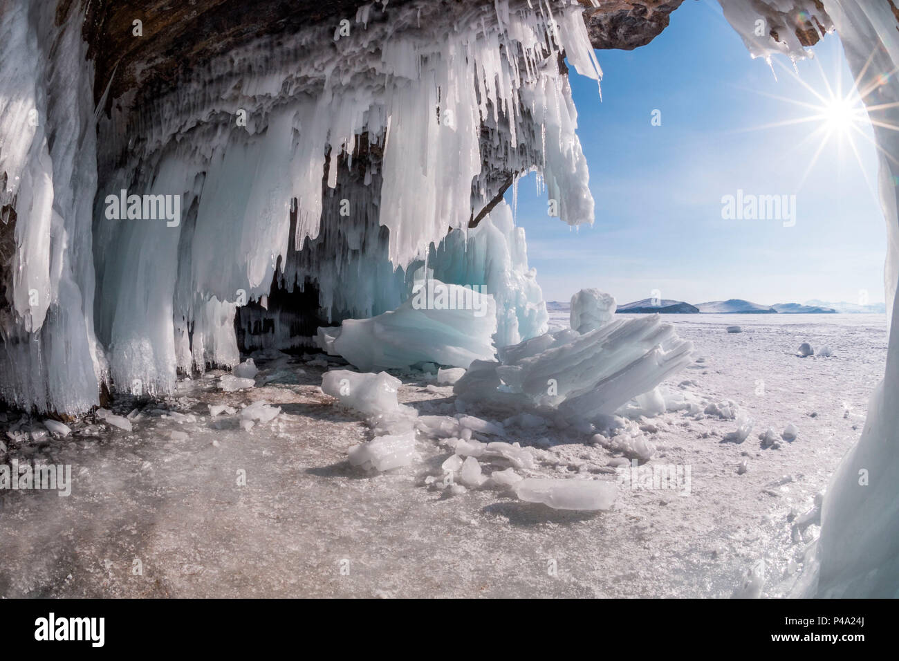 Ice stalactites in a cave at the shore of lake Bajkal, Irkutsk region ...
