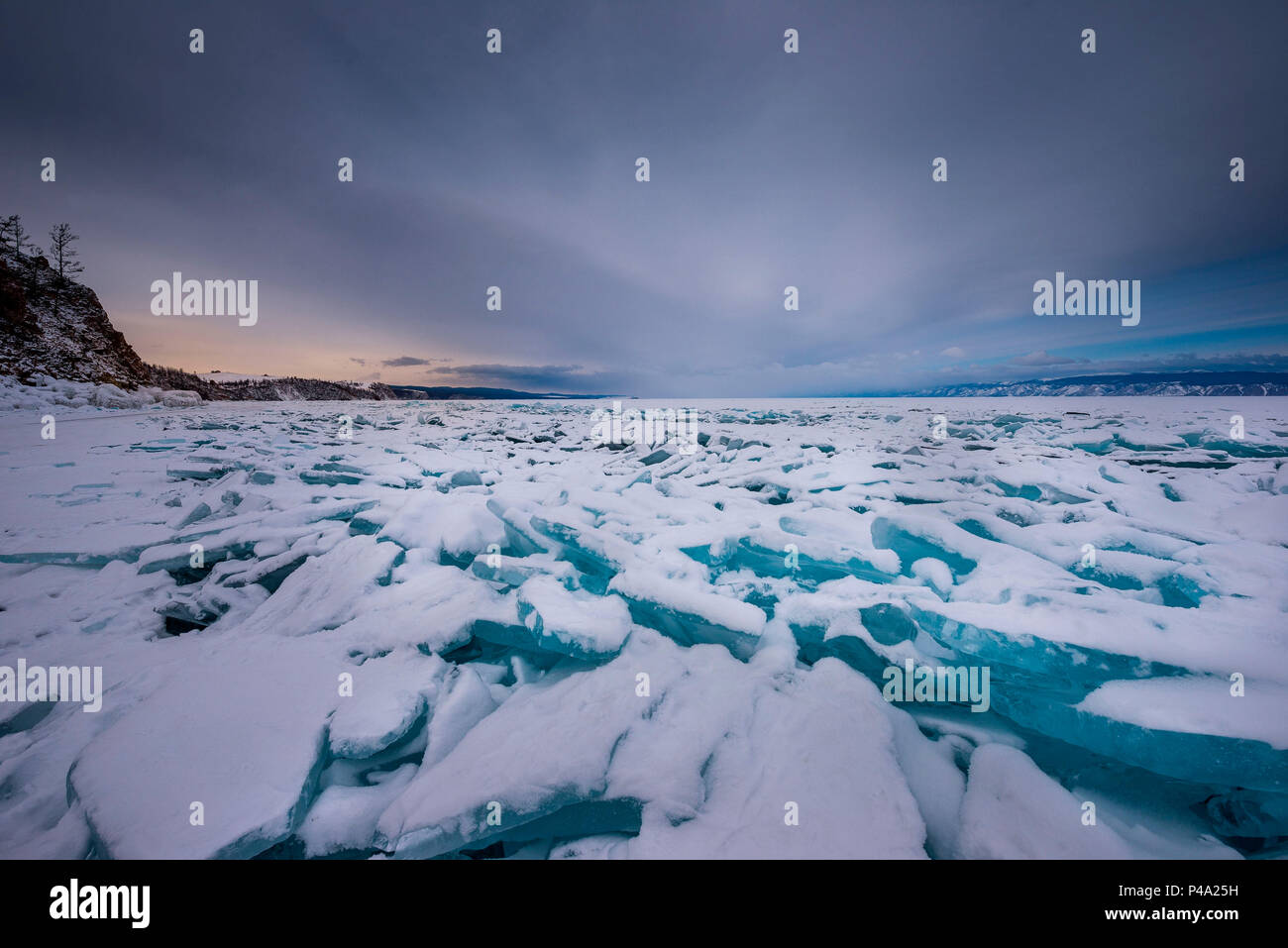 Pieces of ice under the snow at Lake Baikal, Irkutsk region, Siberia ...