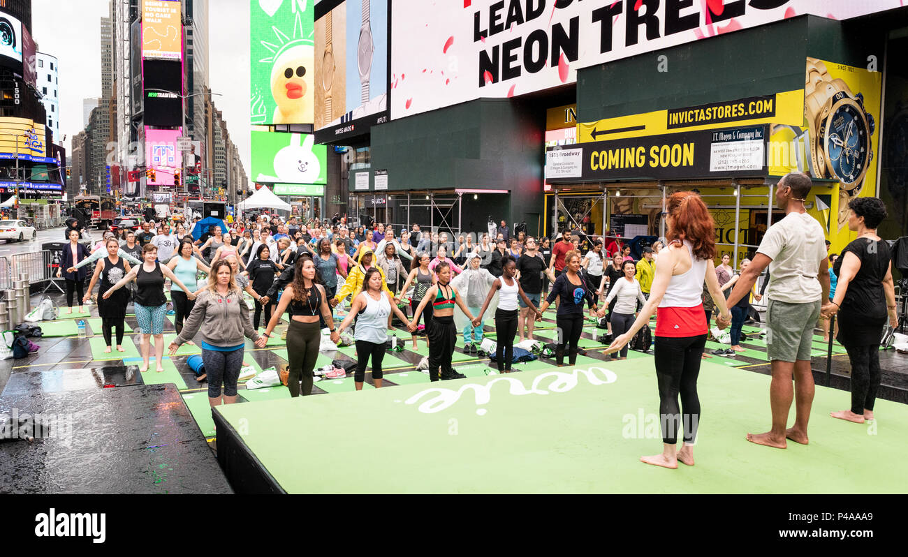 Instructors seen giving advice while people performs Yoga. Large yoga ...