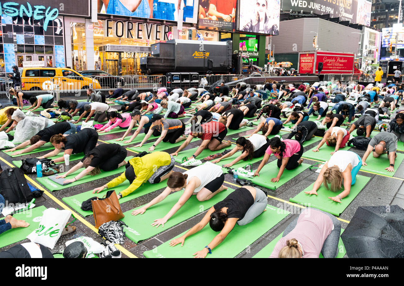 General view of people performing Yoga. Large yoga session in Times ...