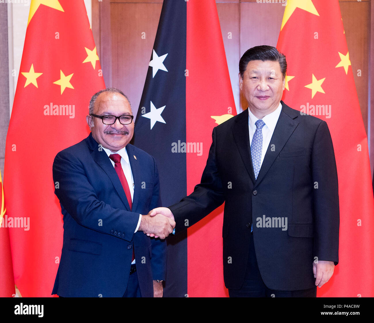 Beijing, China. 21st June, 2018. Chinese President Xi Jinping (R) meets ...