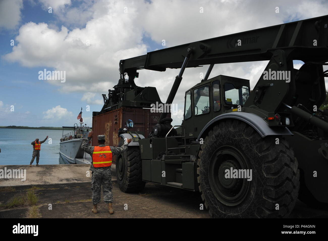 The 390th SPOC Soldiers moved 11,000-pound containers onto the LCM by ...