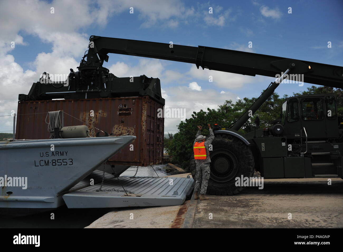 390th SPOC Soldiers operated a Rough Terrain Container Handler (RTCH ...