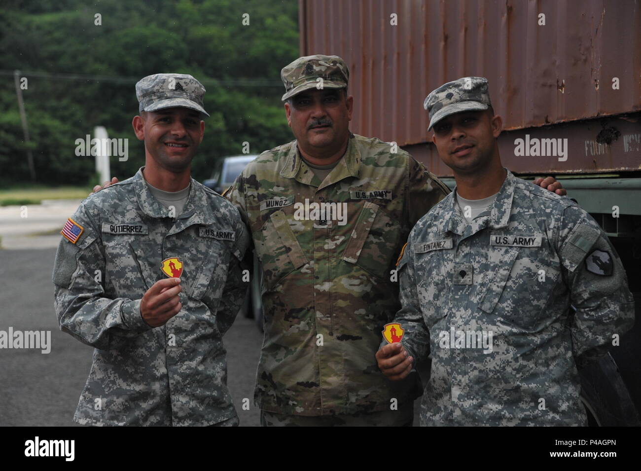 1st MSC, Command Sgt. Maj. Harry Muñoz., awards Sgt. Kris Gutierrez and ...