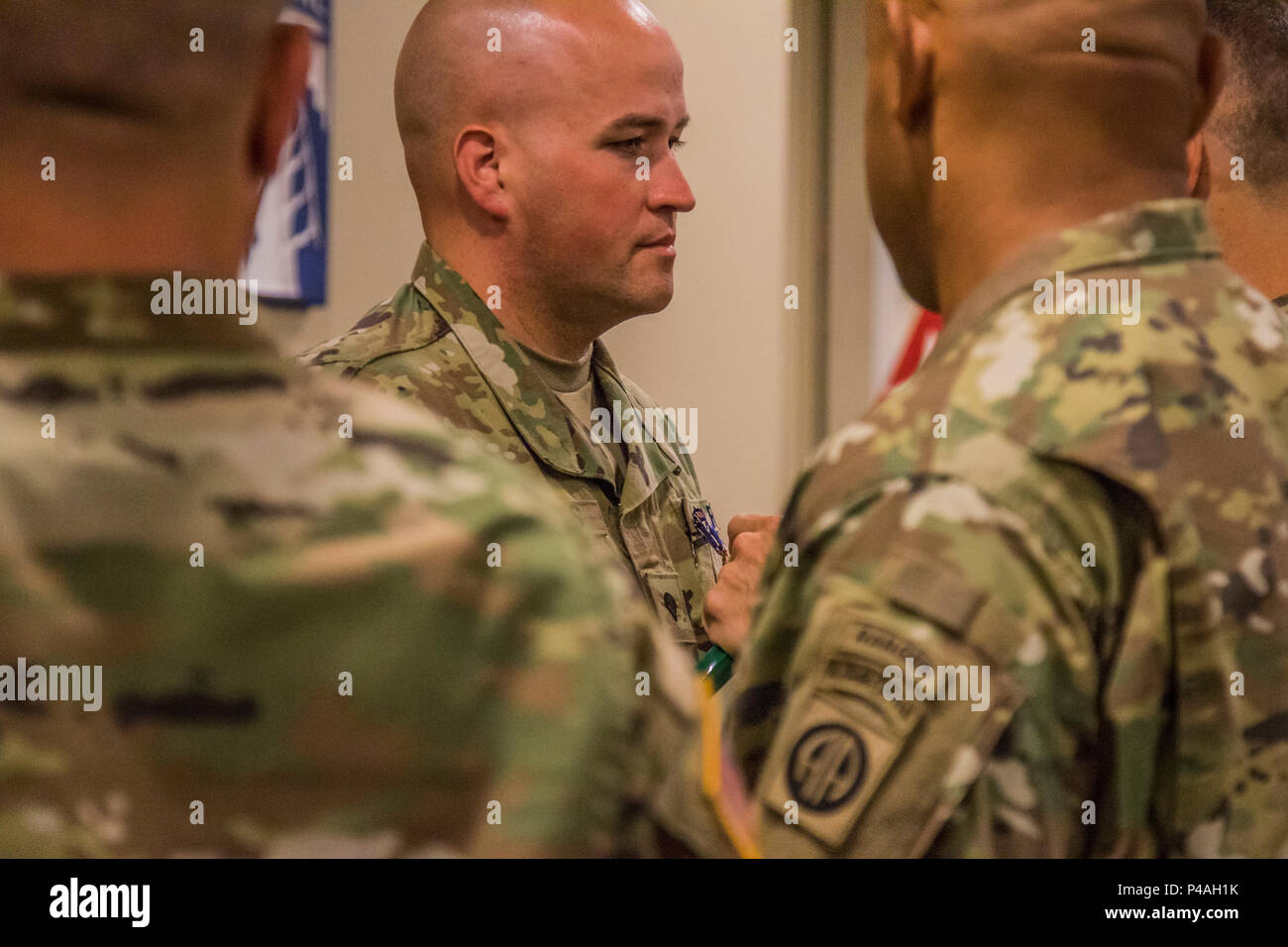 The Soldier's Medal is pinned on Spc. Benjamin Rogers, 82nd Combat ...
