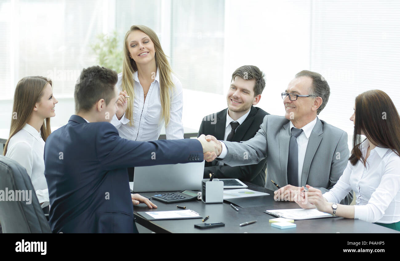 business partners shaking hands after a successful transaction.concept ...