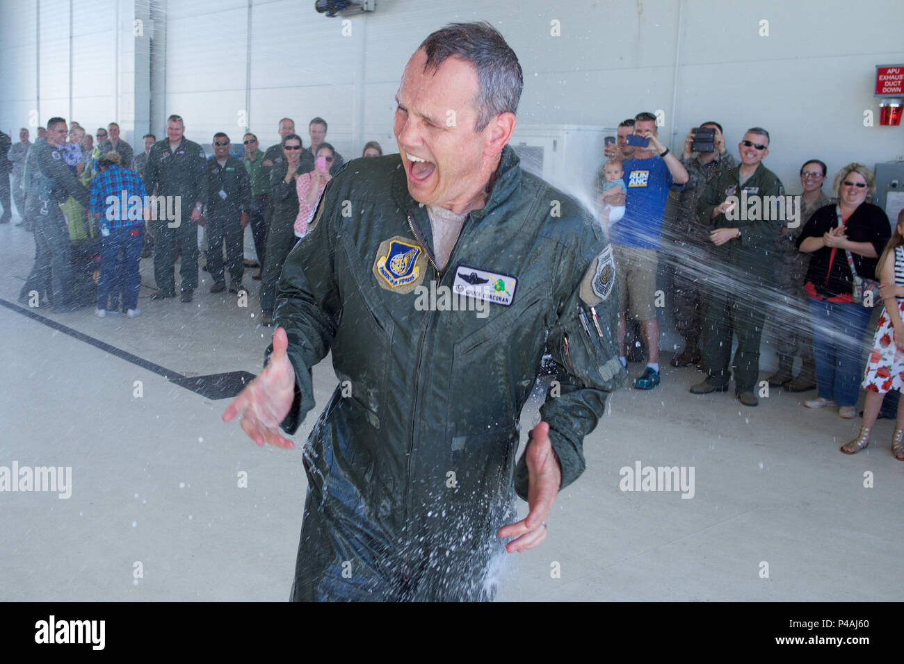 Family members spray Col. Charles Corcoran, former 3rd Wing commander ...