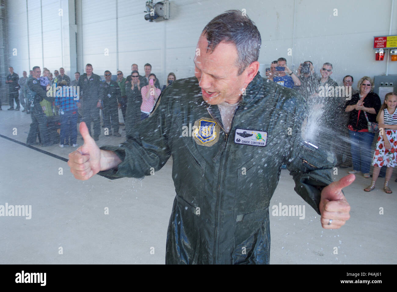 Family members spray Col. Charles Corcoran, former 3rd Wing commander ...