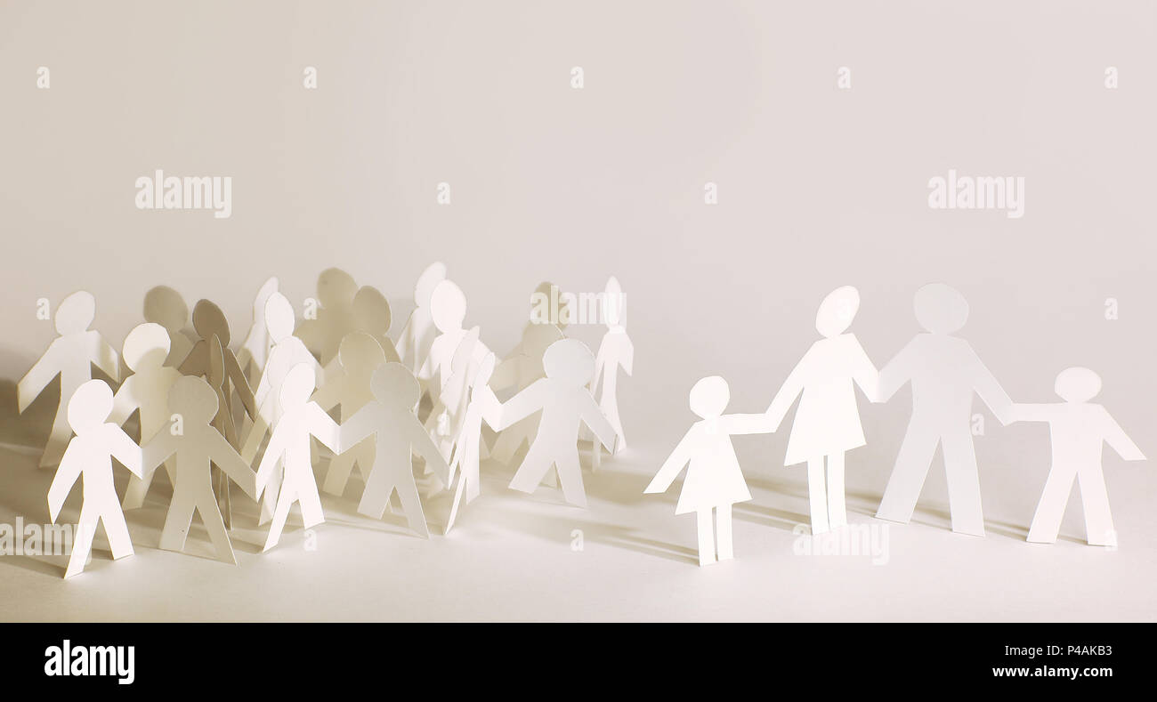many paper men on the paper background.business background Stock Photo ...