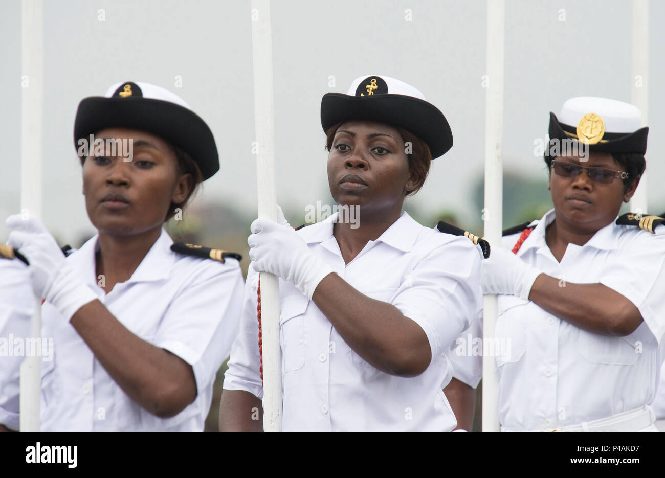 Members of the Gabonese Armed Forces hold the flags of each ...
