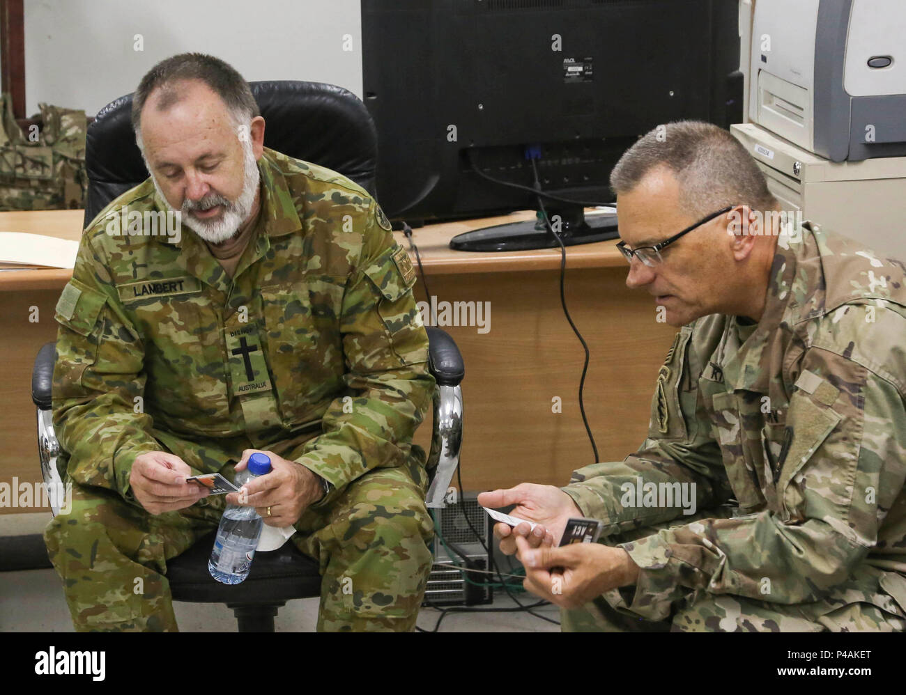 U.S. Army Chaplain (Lt. Col.) Dan Knaup shows Bishop Ian Lambert, the ...