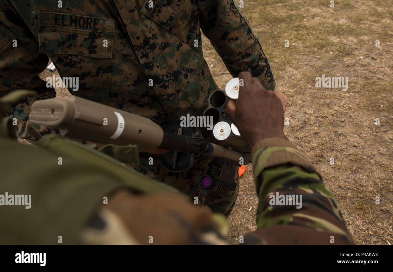 A Trinidad and Tobago service member loads the M32 with non-lethal ...